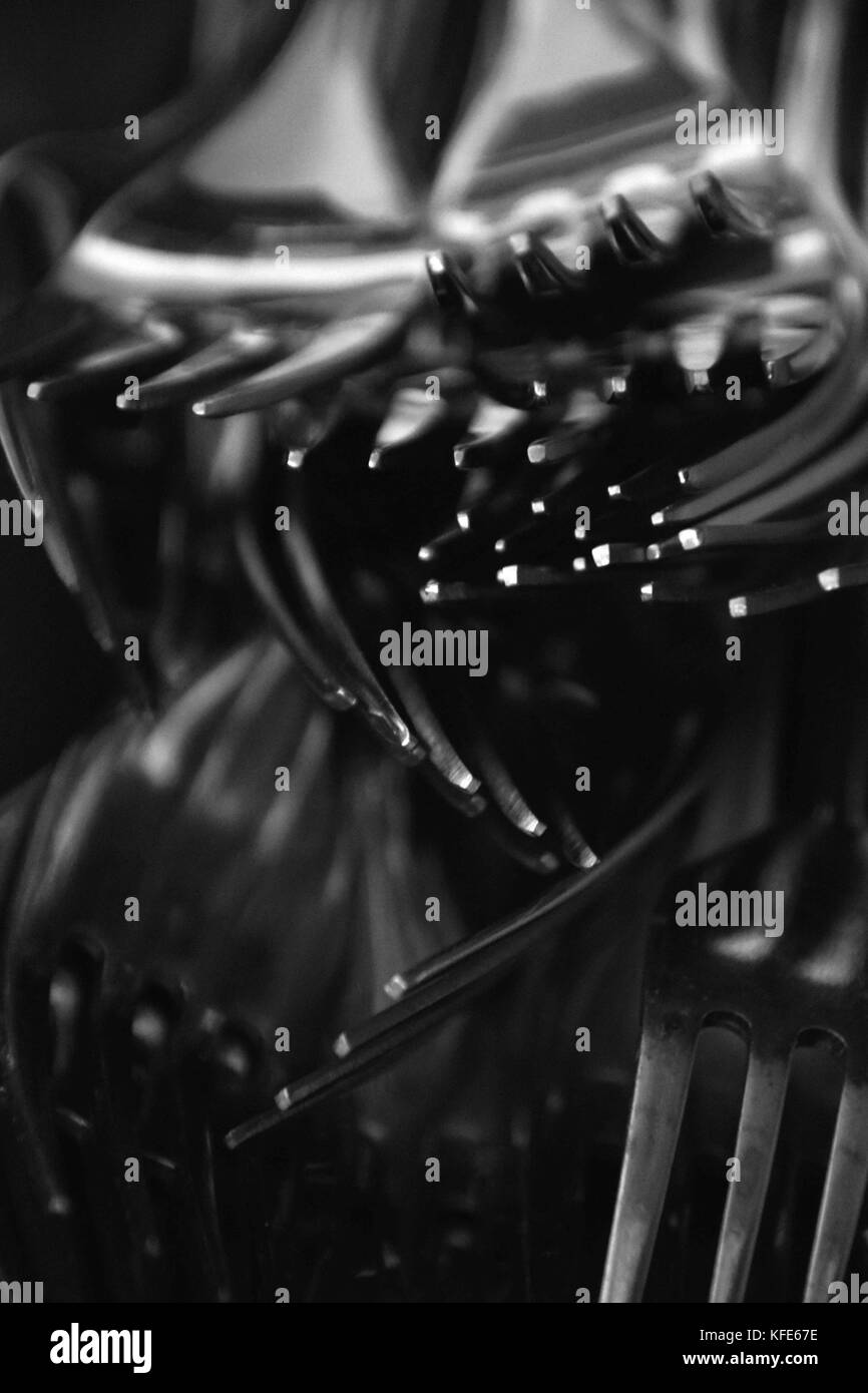 forks in black and white, abstract stacked forks in a cutlery rack ...