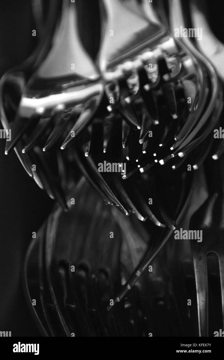 forks in black and white, abstract stacked forks in a cutlery rack ...