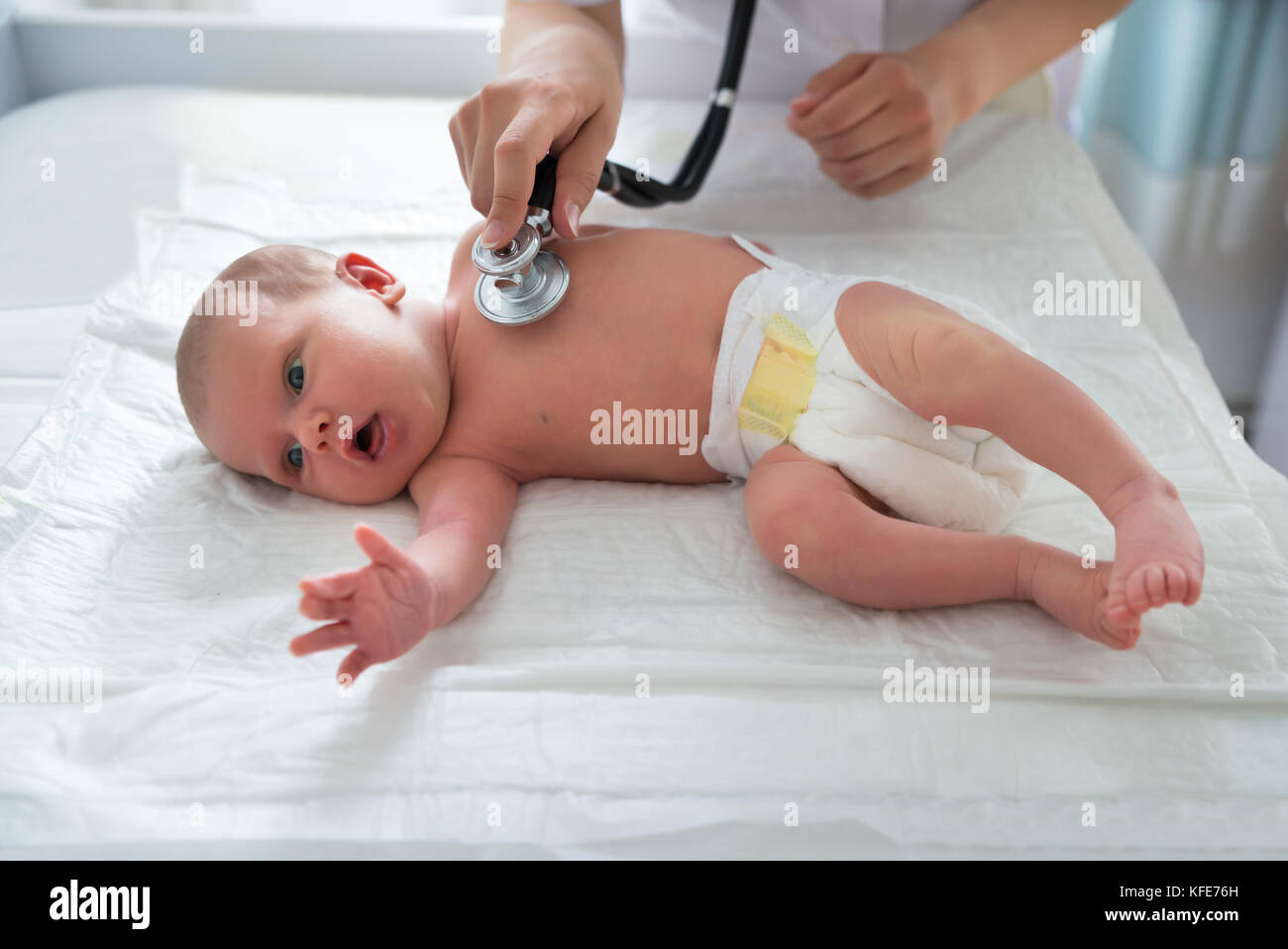 Pediatrician Examining Baby Girl With A Stethoscope Stock Photo - Alamy