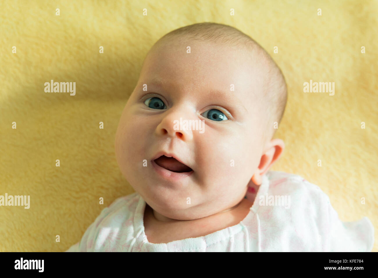 Portrait On An Adorable Innocent Child On Yellow Blanket Stock Photo ...