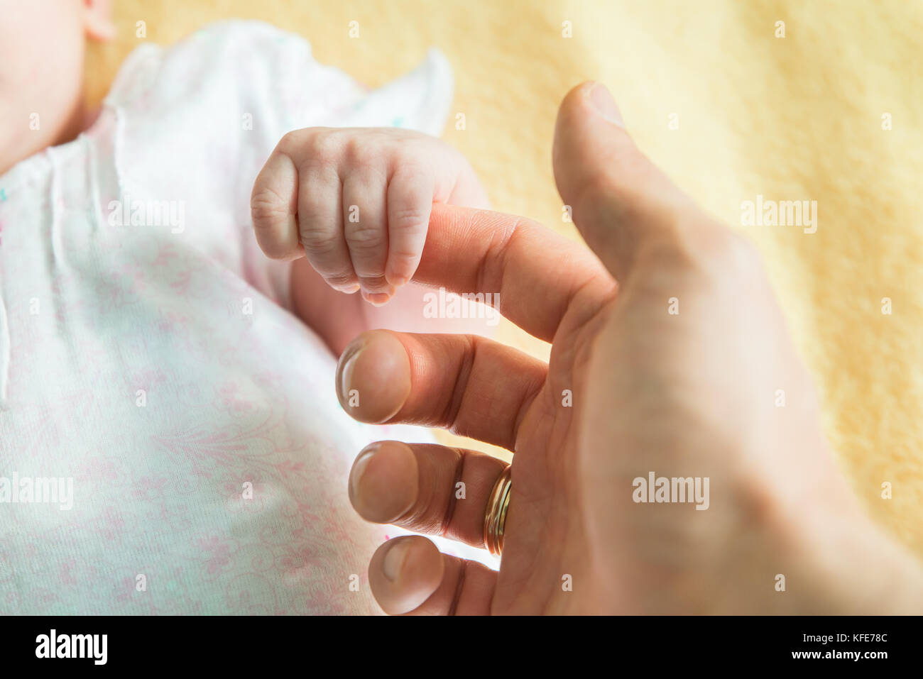 Close-up Of A New Born Baby Holding Parent's Finger Stock Photo - Alamy