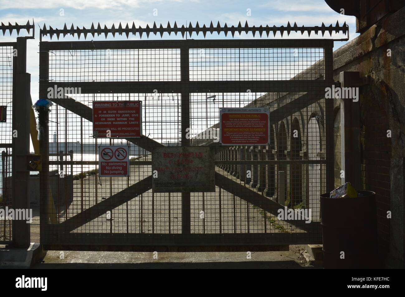 Metal security gate on harbour wall in Newhaven, England Stock Photo ...