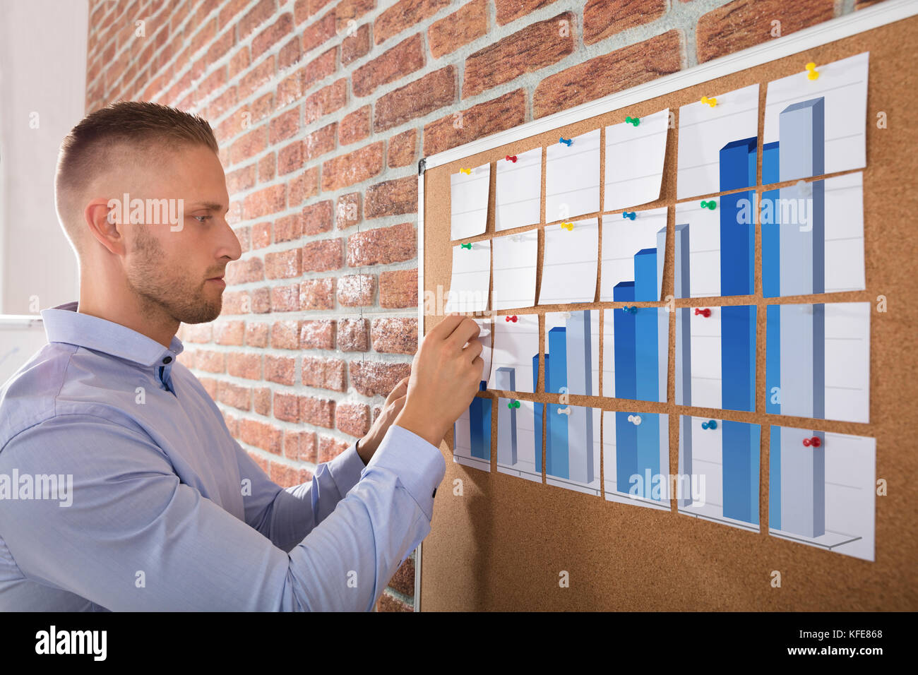 Close-up Of A Businessman Arranging Graph Made On Notes Over The ...