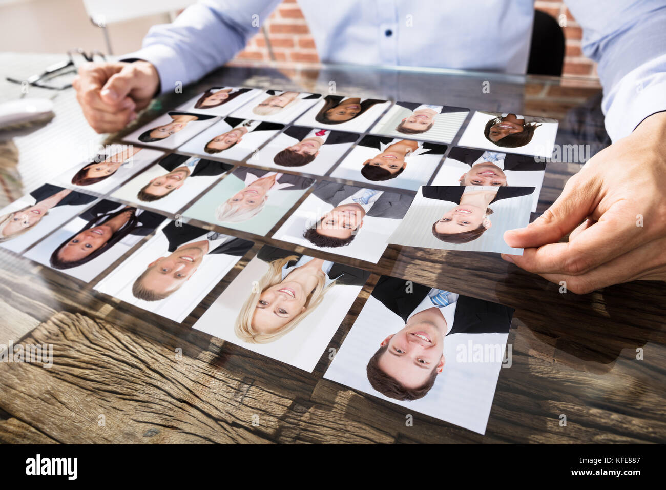 Close-up Of A Businessman Making Candidate Selection Over The Desk At ...