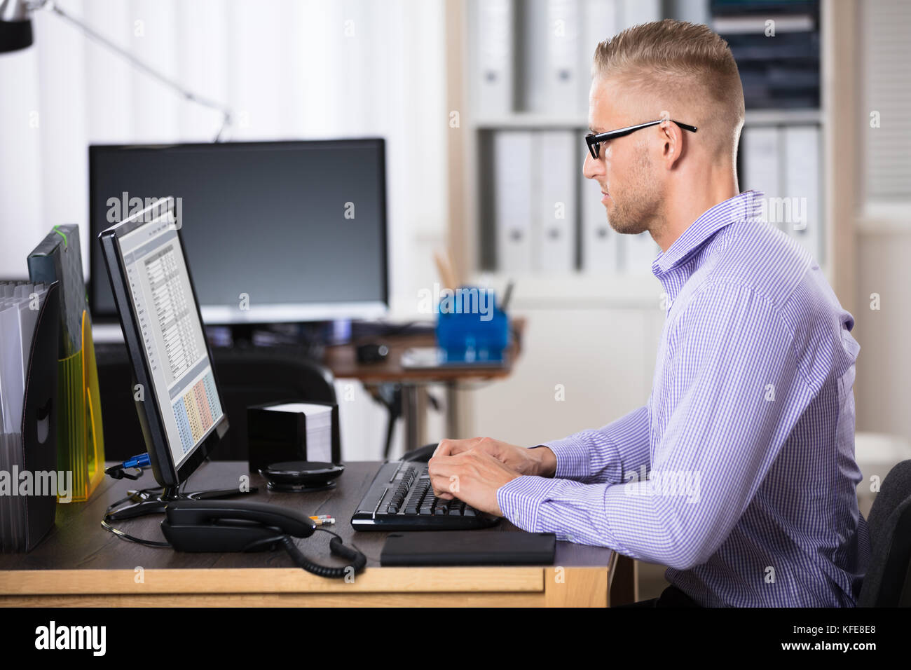 Close-up Of A Businessman Using Computer In Office Stock Photo - Alamy