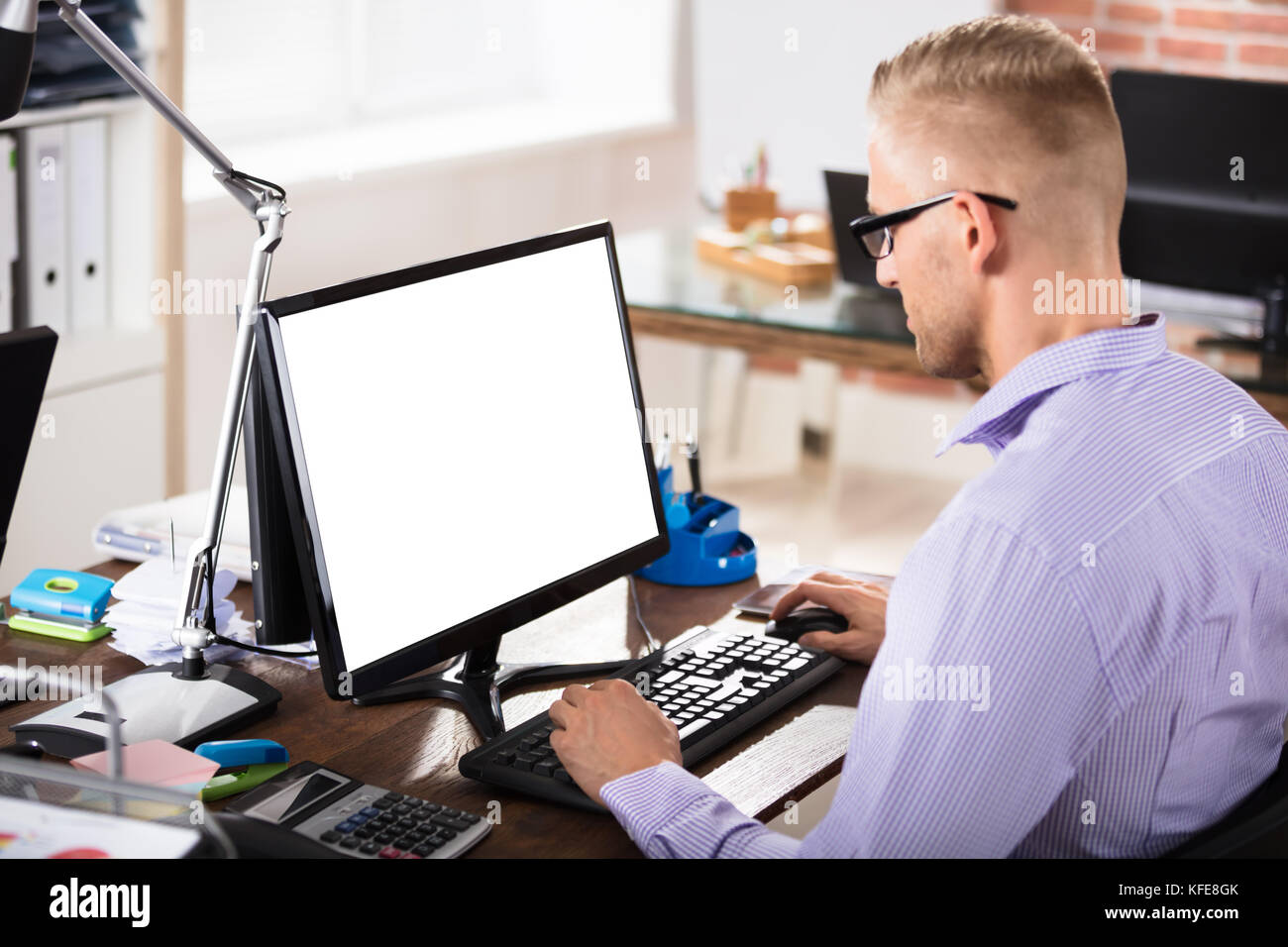 Businesswoman Working On Blank White Screen Computer In Office Stock ...