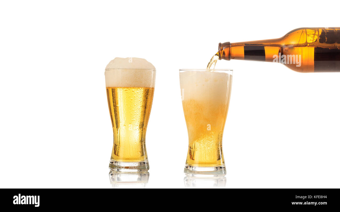 Bottle of beer pouring beer in a glass on white background Stock Photo ...
