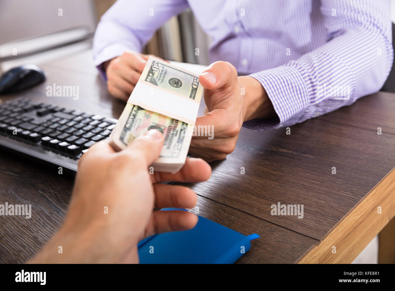 Close-up Of A Person Giving Bribe To Businessman At Workplace Stock ...
