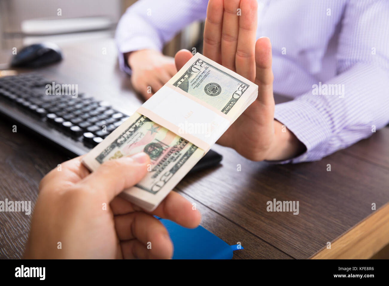 Cropped Hand Of Businessman Refusing To Take Bribe From Partner At ...