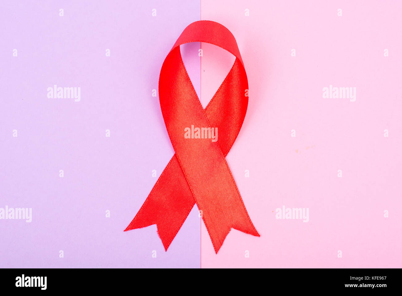 Red ribbon-symbol of awareness about AIDS Stock Photo - Alamy