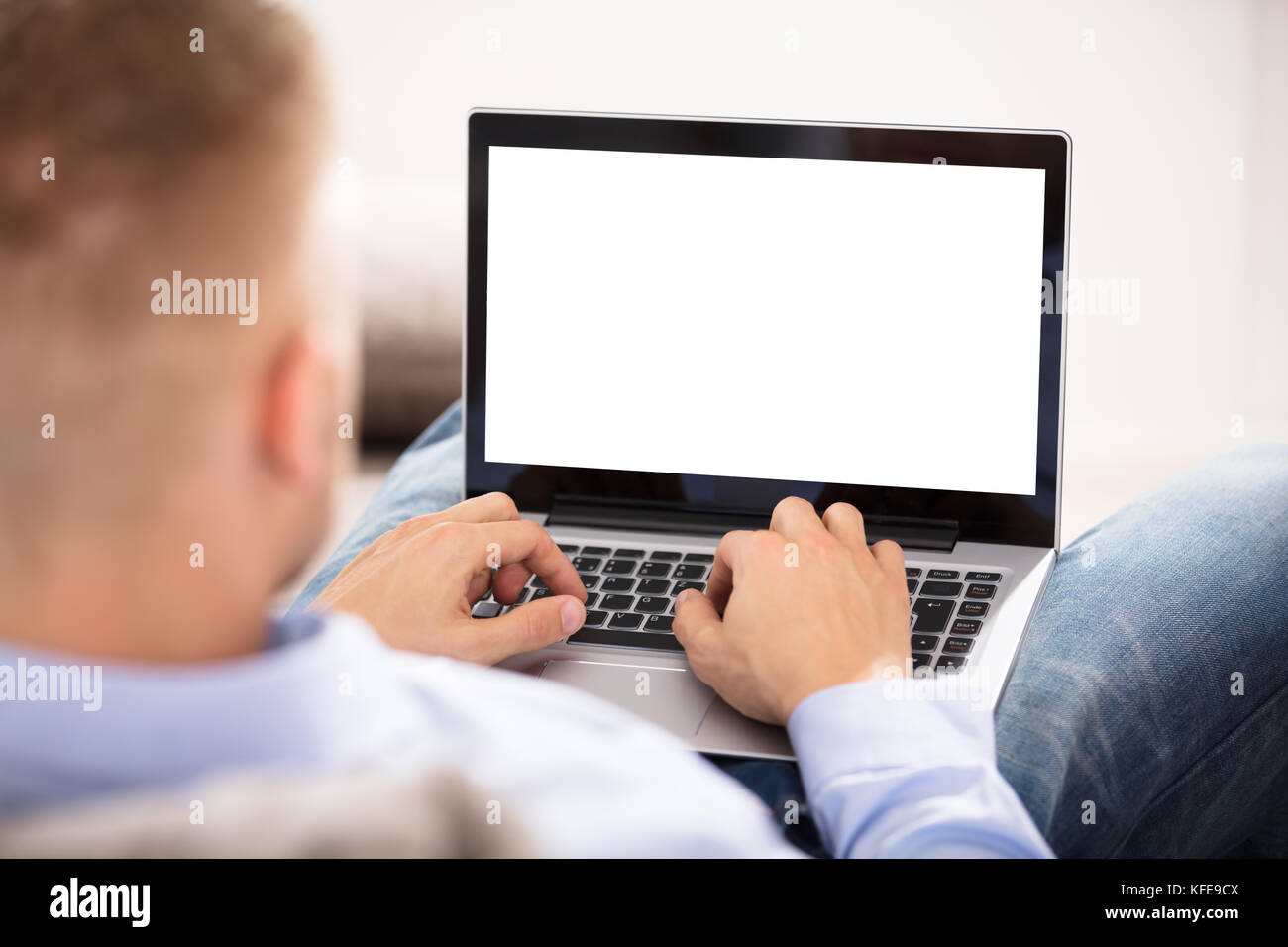 Close-up Of A Man With Laptop Showing Blank White Screen Stock Photo ...