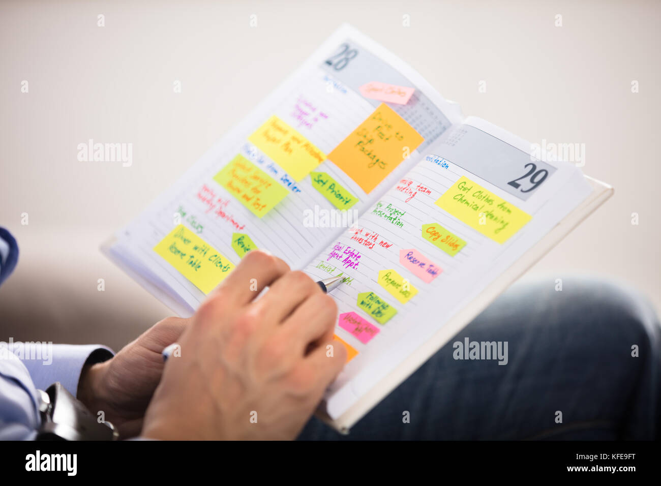 Close-up Of Man Writing Important Notes In Diary With Pen Stock Photo ...