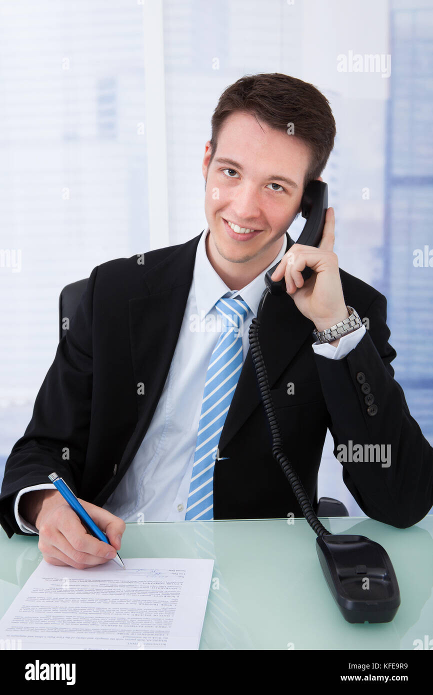 Male receptionist notes hi-res stock photography and images - Alamy