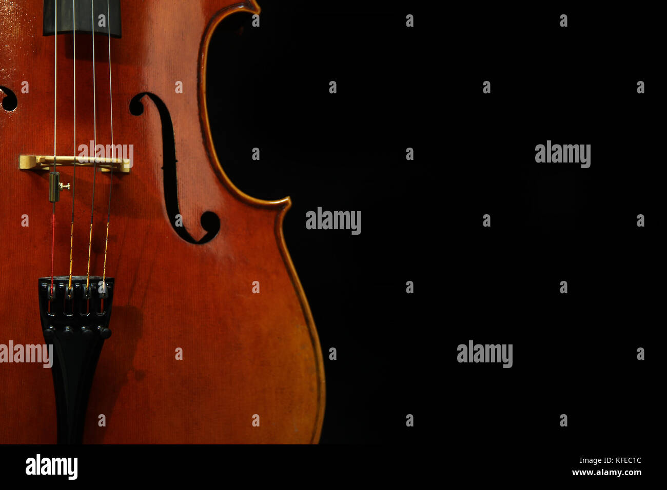Musical instruments / Cello on a black background Stock Photo - Alamy
