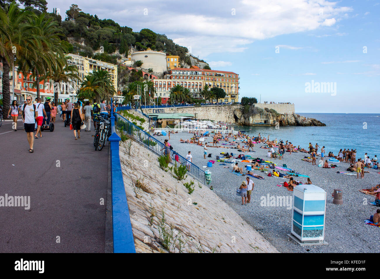 People enjoy a beautiful summer sunset in the Opera Plage, the oldes ...
