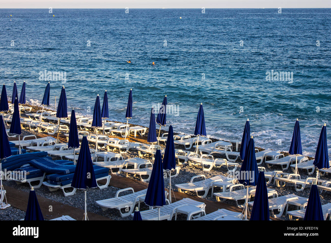 People enjoy a beautiful summer sunset in the Opera Plage, the oldes ...