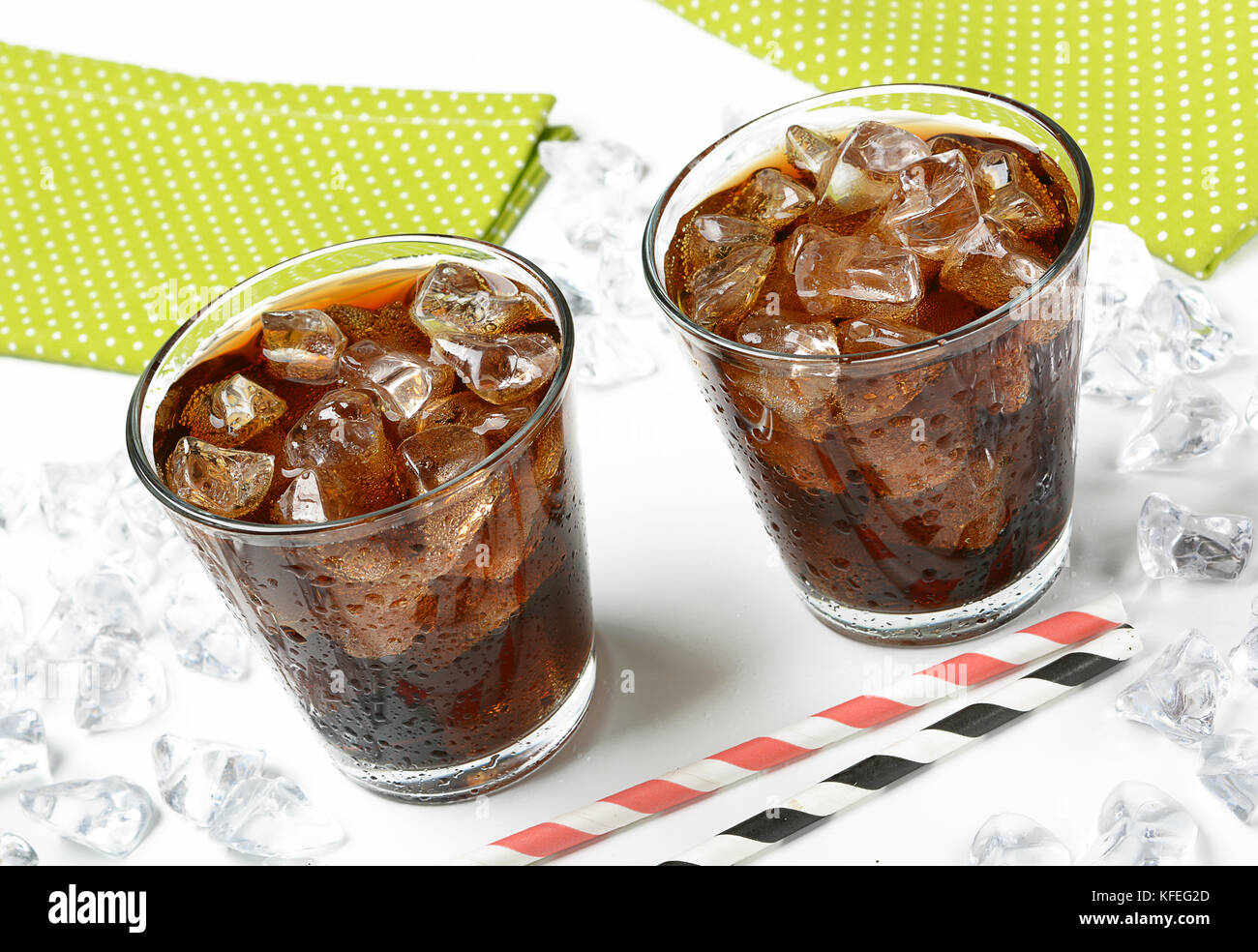 Cola with crushed ice in the glass on white background - closeup Stock ...