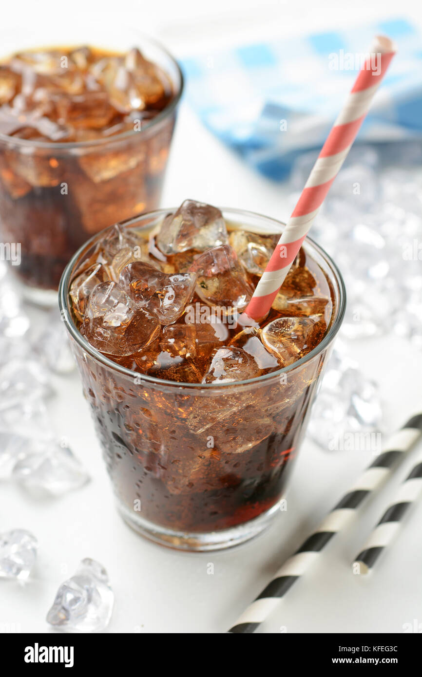Cola with crushed ice in the glass on white background - closeup Stock ...