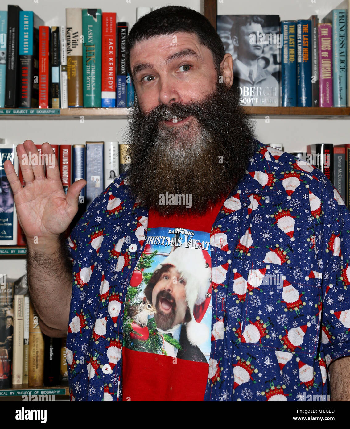Mick Foley signs his book, "Saint Mick: My Journey From Hardcore Legend ...