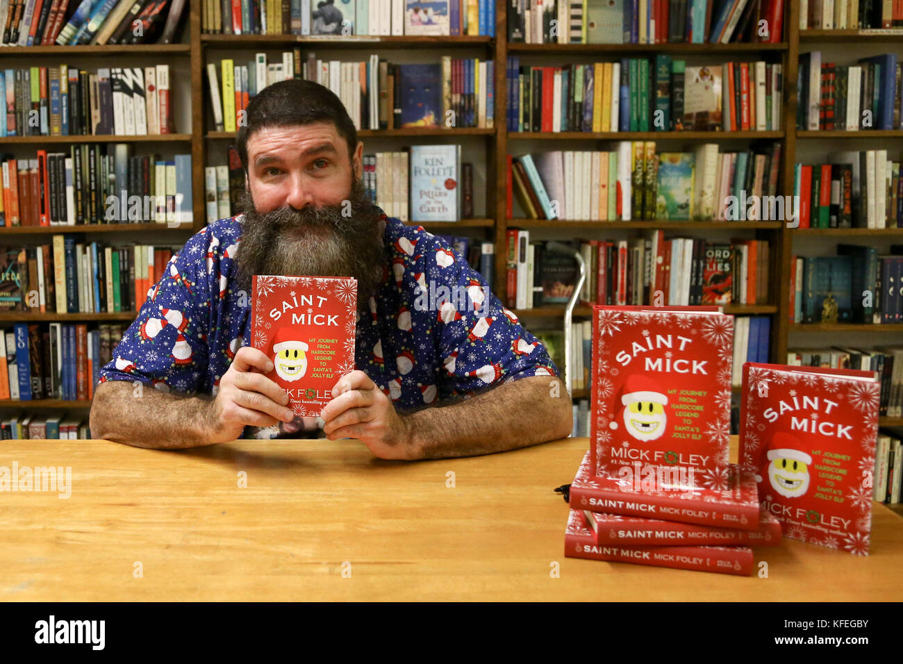Mick Foley signs his book, "Saint Mick: My Journey From Hardcore Legend ...