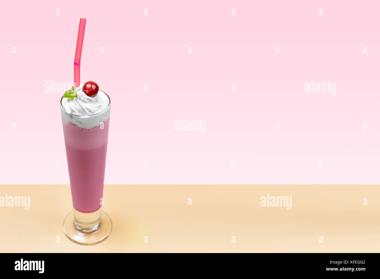Fruit Milkshake in high glass with tube Stock Photo - Alamy
