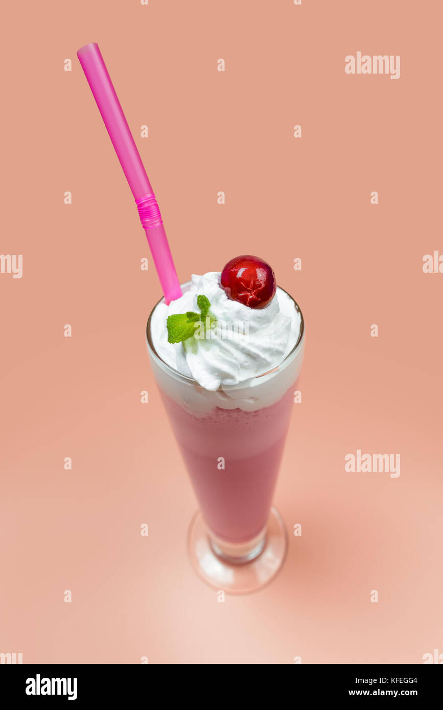 Fruit Milkshake in high glass with tube Stock Photo - Alamy