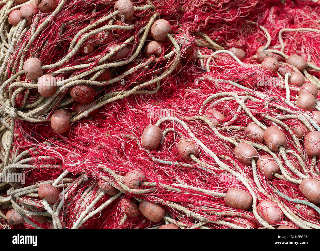background of red fishing nets with floats used to fish at sea Stock ...