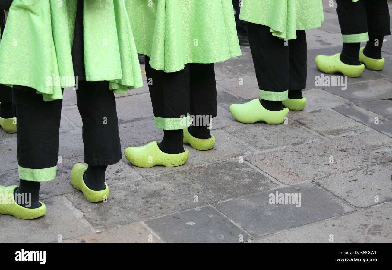 so many Dutch people with green clogs and black trousers Stock Photo ...