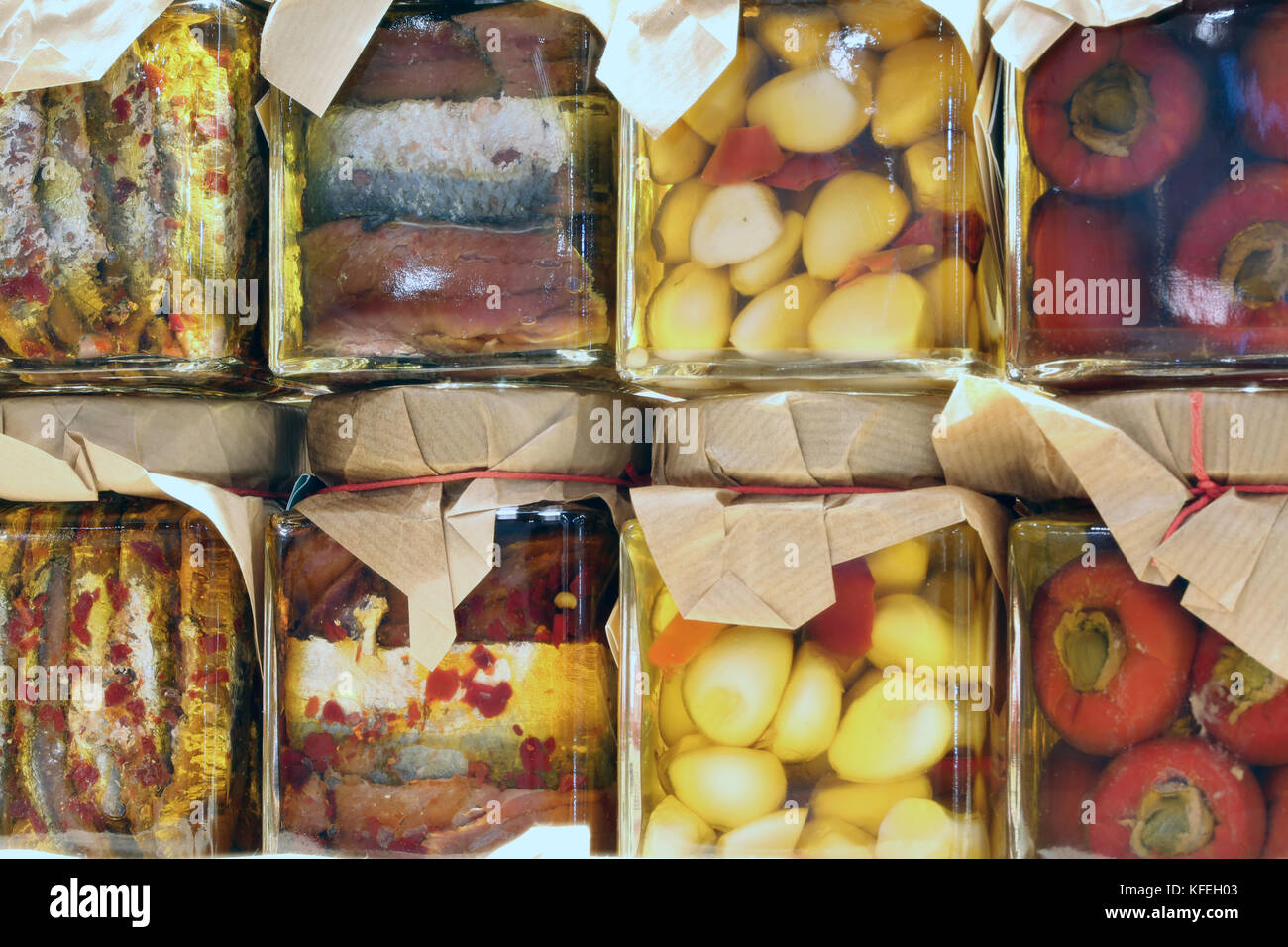 jars of typical Italian products preserved in oil with garlic and ...