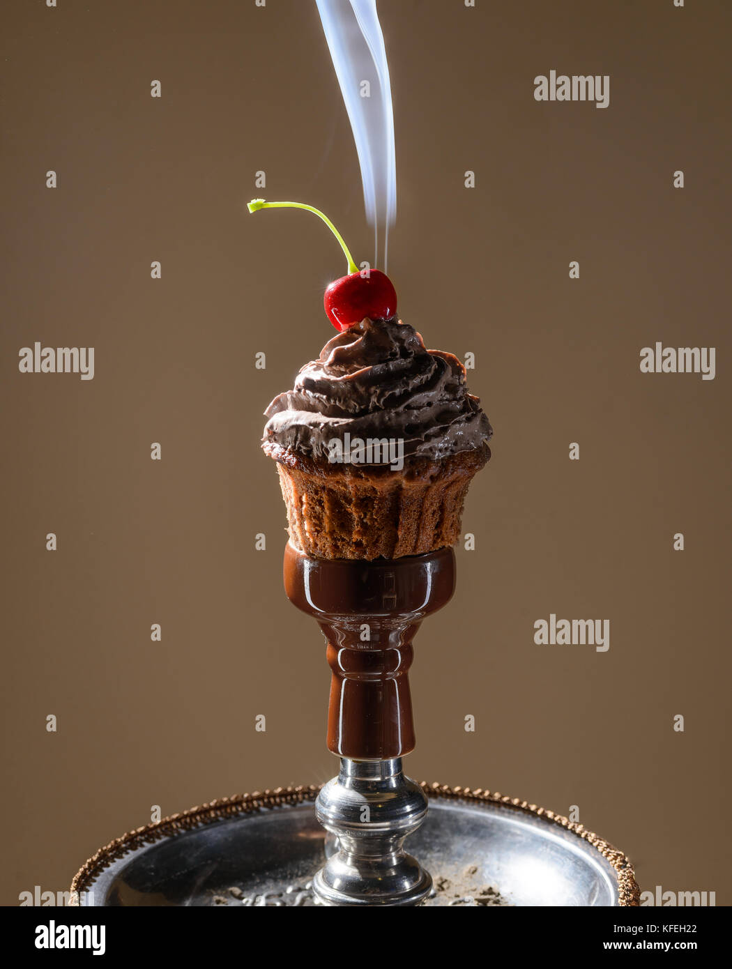 Smoking hookah with fruit head on dark background Stock Photo - Alamy