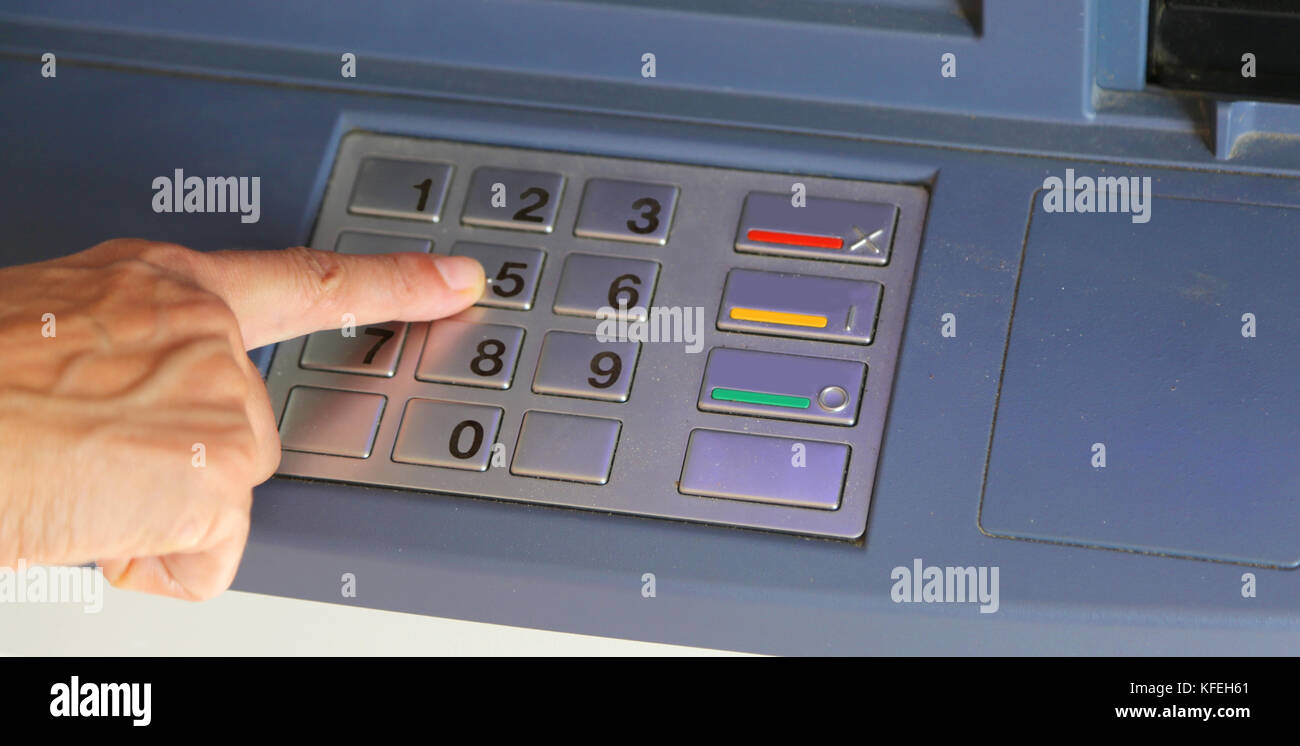 hand of woman typing the secret code on the ATM keyboard Stock Photo ...