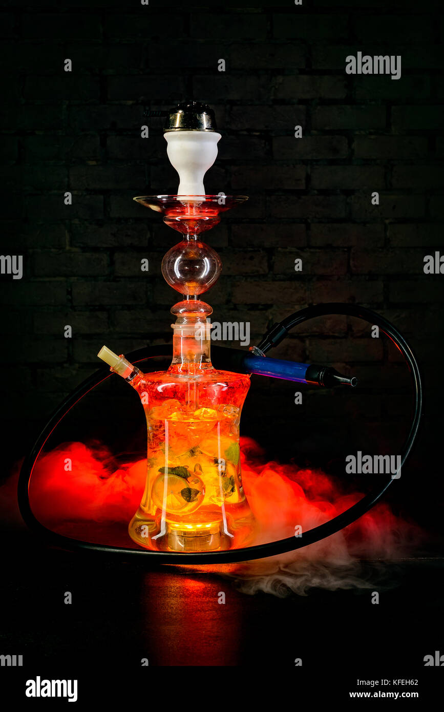 Colorful glass smoking hookah with fruits inside Stock Photo - Alamy