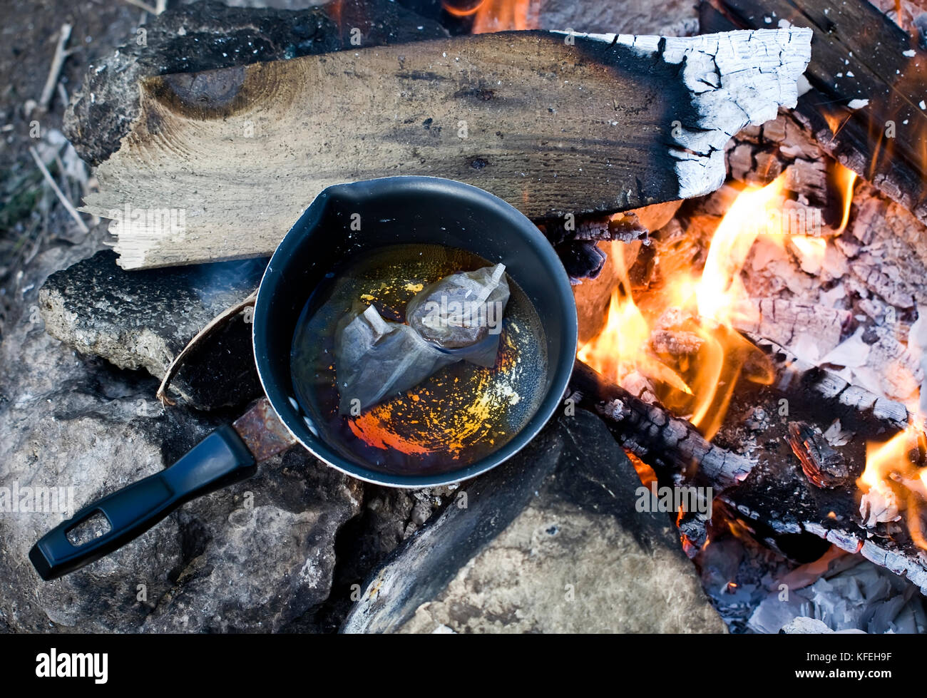Brewing tea on a burning bonfire excellent to portray outdoor leisure ...