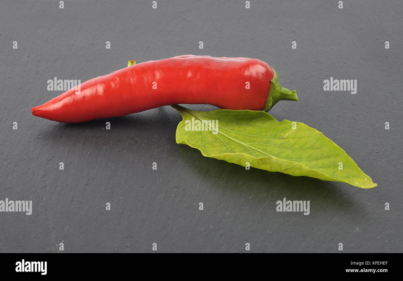 Ball pepper on slate Stock Photo - Alamy