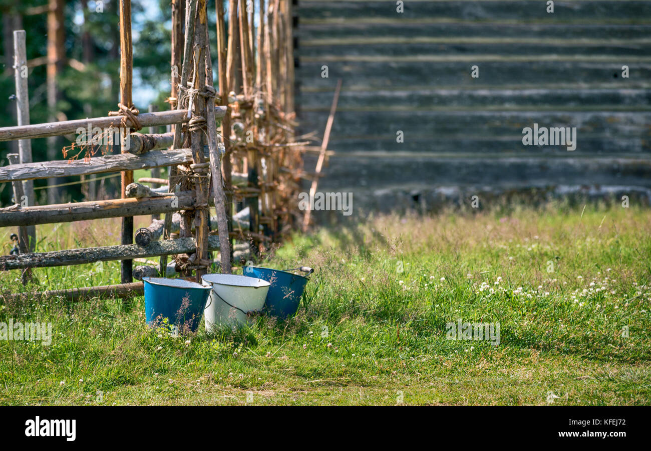 Farm with three buckets in summer idyll Stock Photo - Alamy