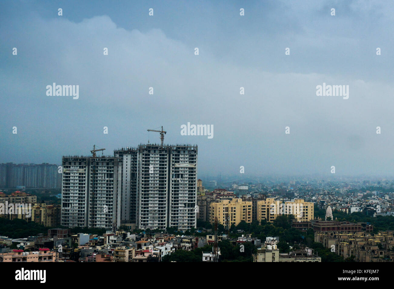 Noida Skyscraper under construction with smaller buildings aroun Stock ...