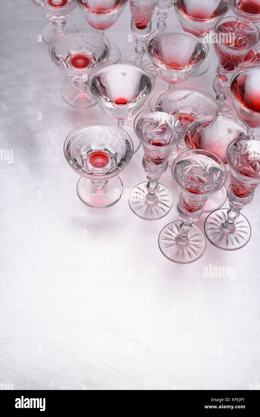 Drinking glasses with alcohol on grey metal table with copy space Stock ...