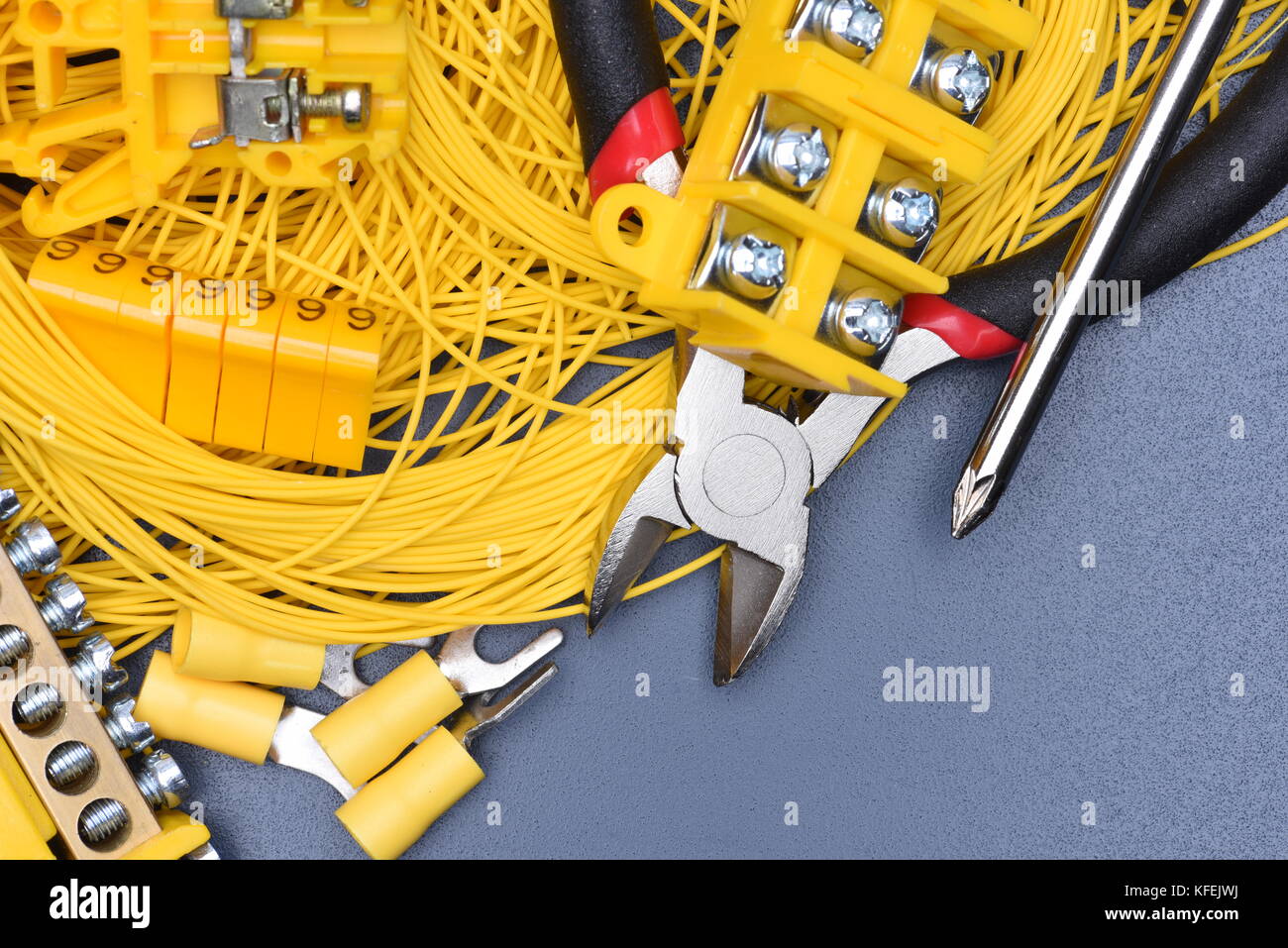 Cables, electrical equipment and tools on metal table , directly above ...