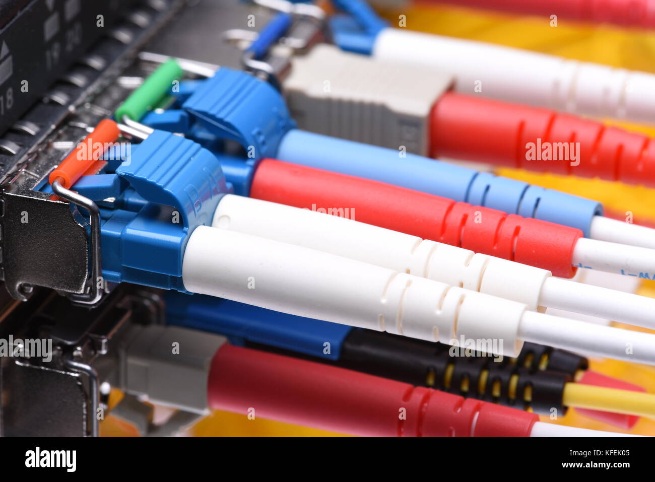 Fiber Optic cables connected to switch in data center Stock Photo - Alamy