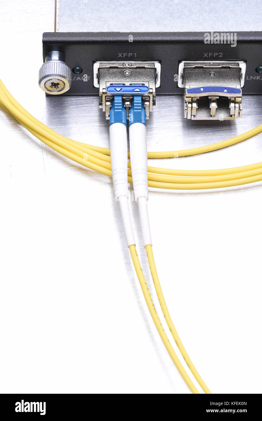 Gigabit interface converter with optical network cables on metal grey ...