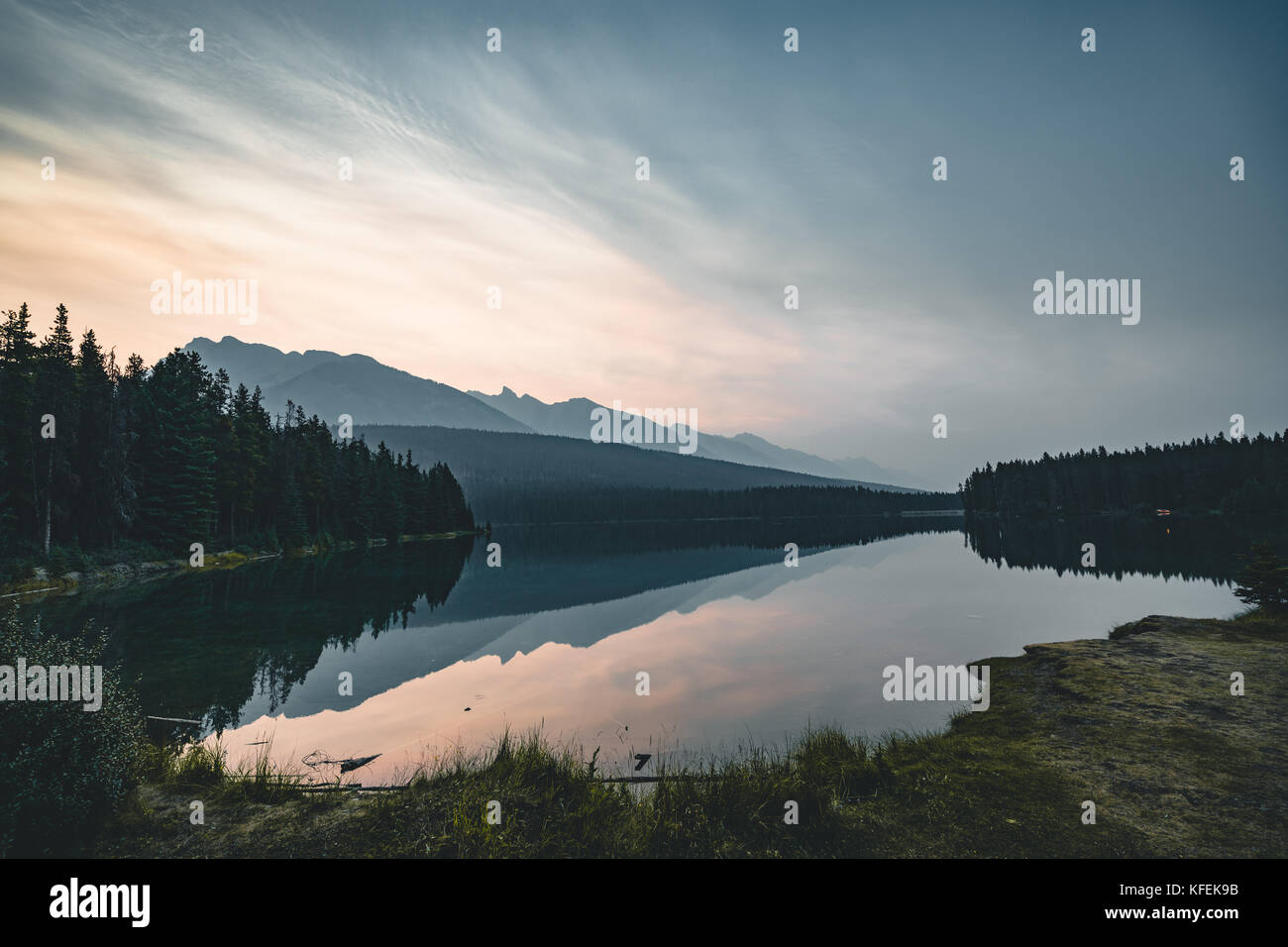 Sunrise and misty morning over Mount Rundle at Two Jack Lake in Stock ...