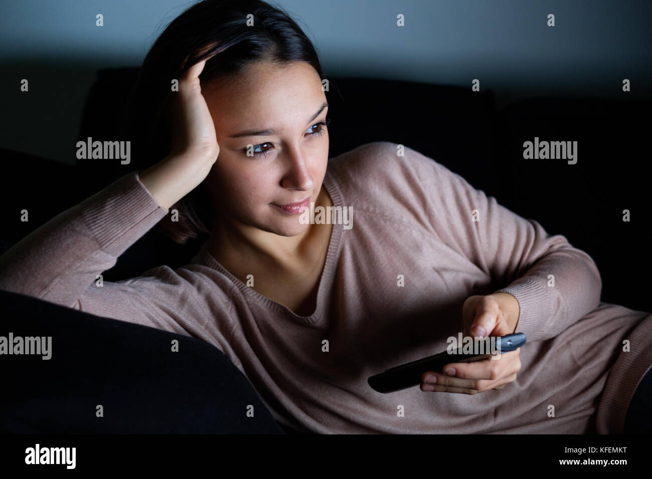 Teenager watching tv night hi-res stock photography and images - Alamy