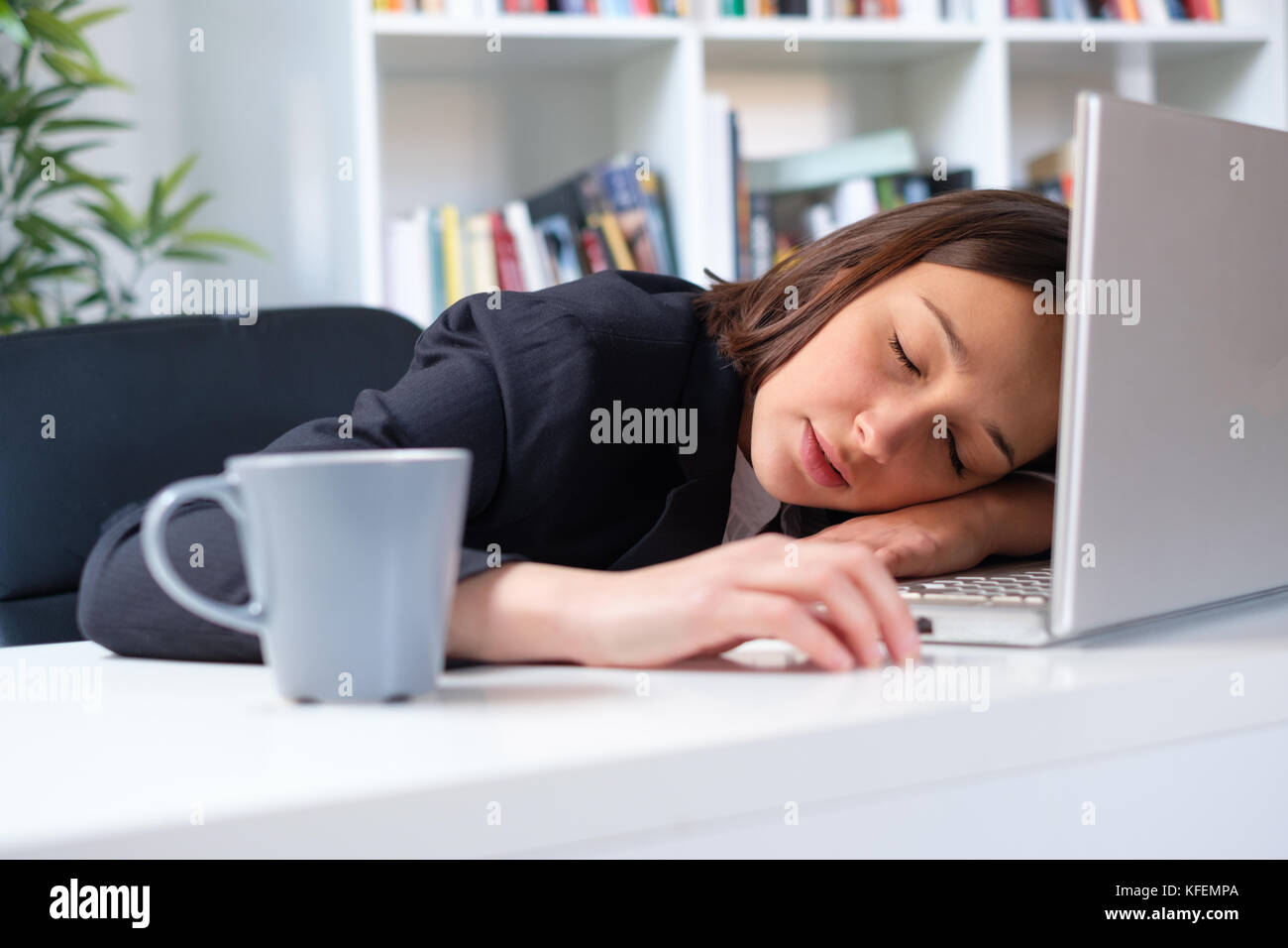Woman sleeping on keyboard laptop hi-res stock photography and images ...