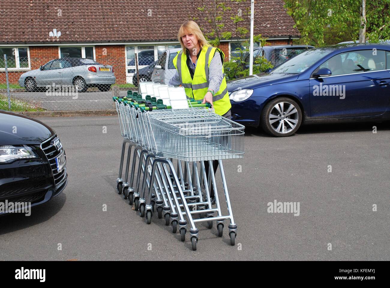 Uk woman pushing trolley shopping hi-res stock photography and images ...