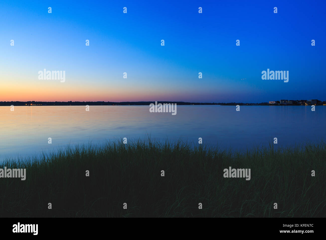 New Jersey inlet with view of the bay, dock, boat and city with boat ...