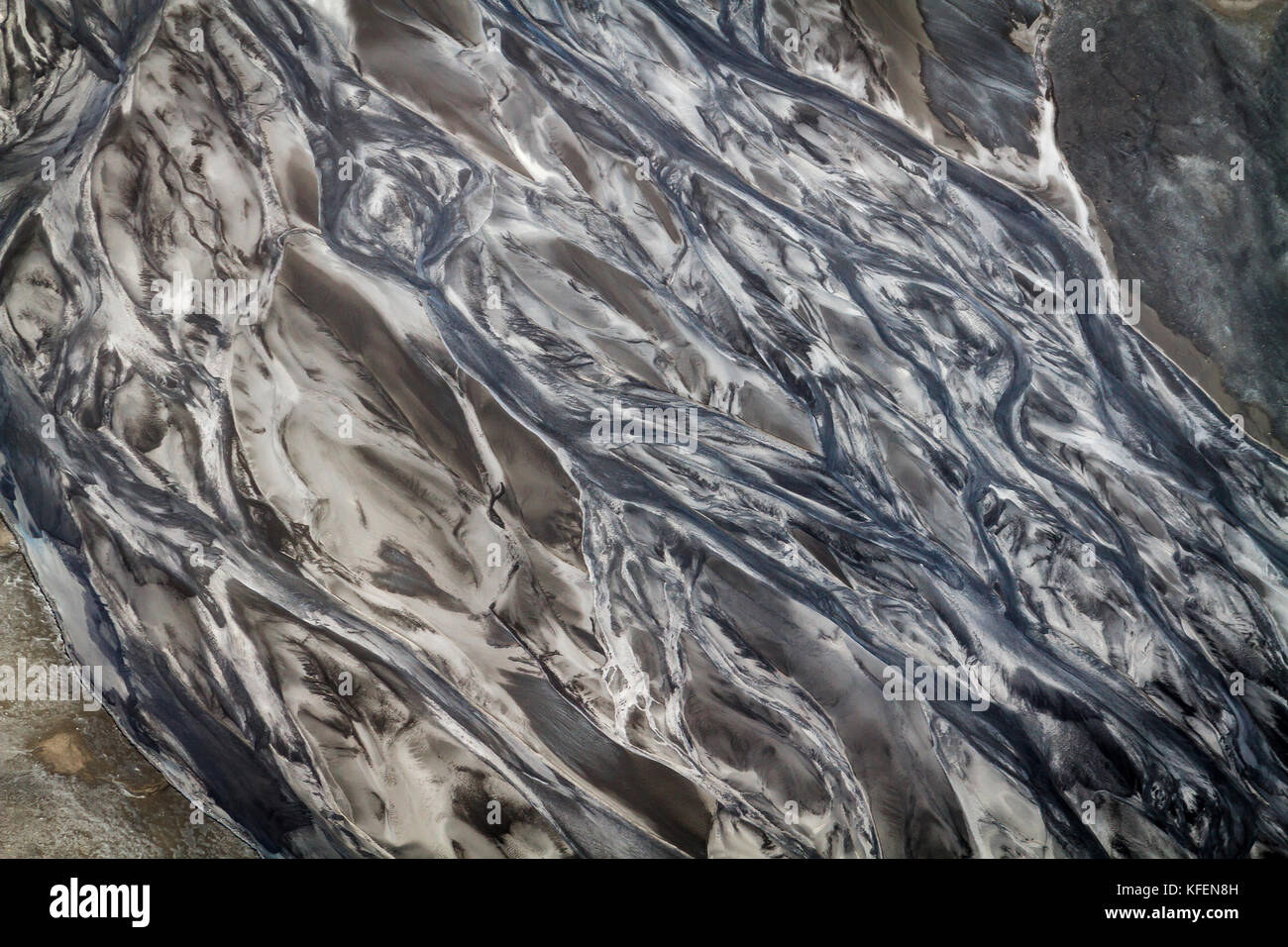 River Shapes in the Black Sand Stock Photo - Alamy