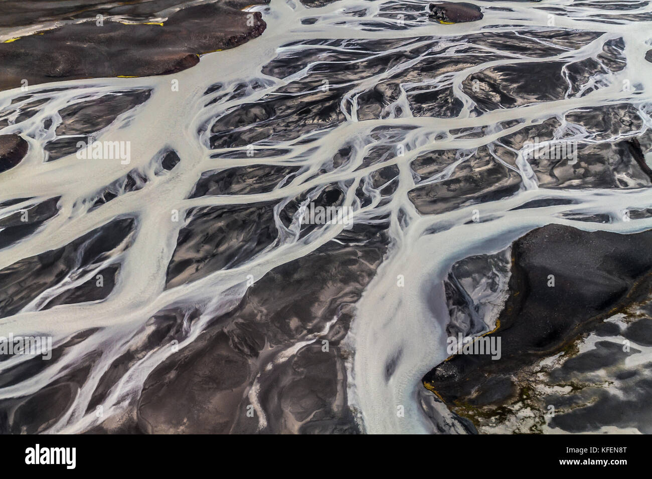 River Shapes in the Black Sand Stock Photo - Alamy