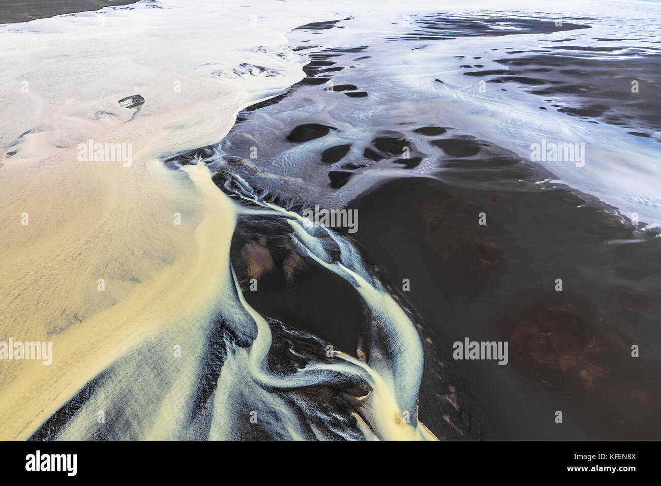 River Shapes in the Black Sand Stock Photo - Alamy