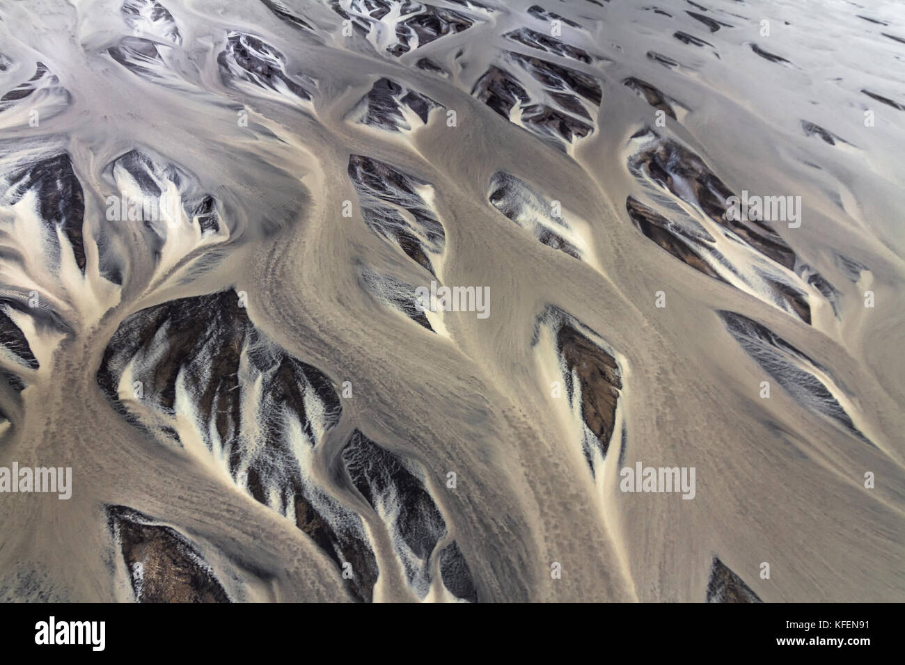 River Shapes in the Black Sand Stock Photo - Alamy
