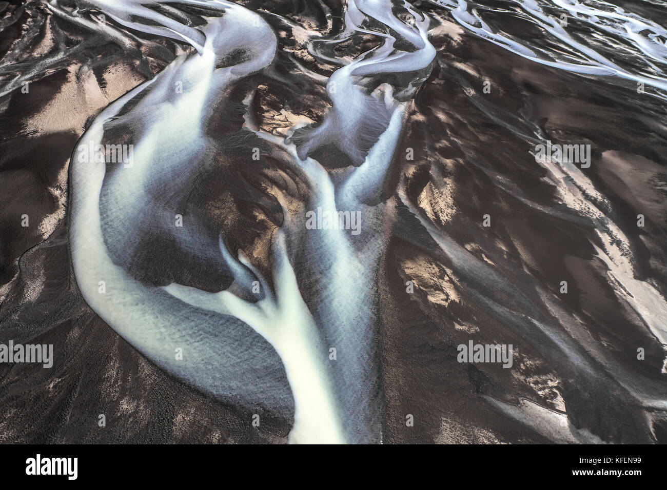 River Shapes in the Black Sand Stock Photo - Alamy